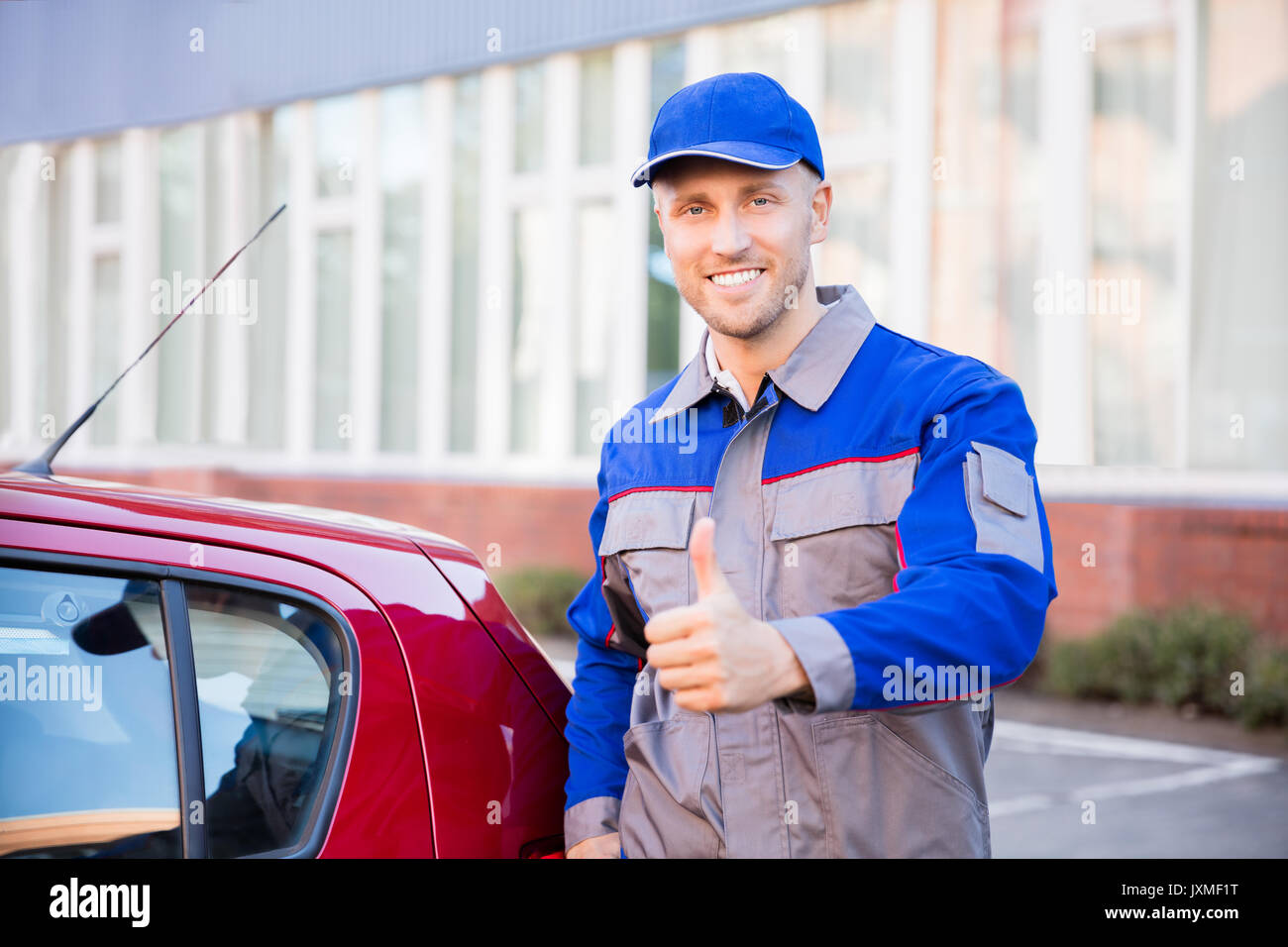 Portrait Of A Happy Young Man Standing Near Car Stock Photo - Alamy