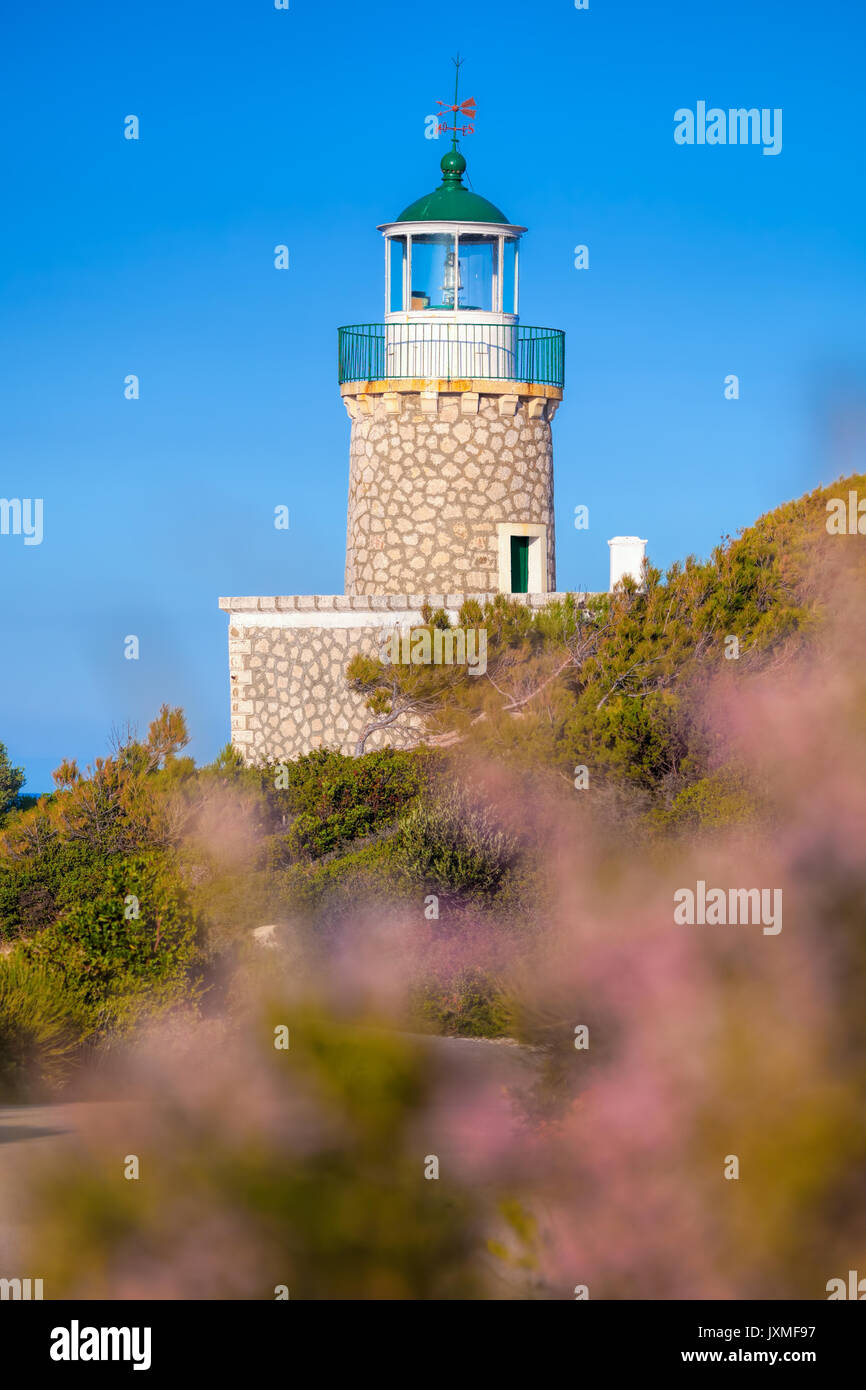 Skinari Lighthouse against Kefalonia island on Zakynthos island, Greece ...