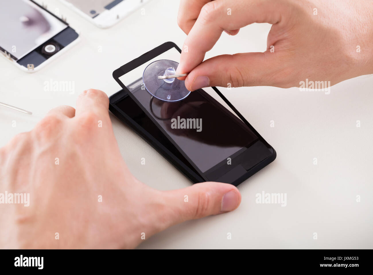 Close-up Of A Person's Hand Repairing Broken Mobile Phone Screen Stock ...