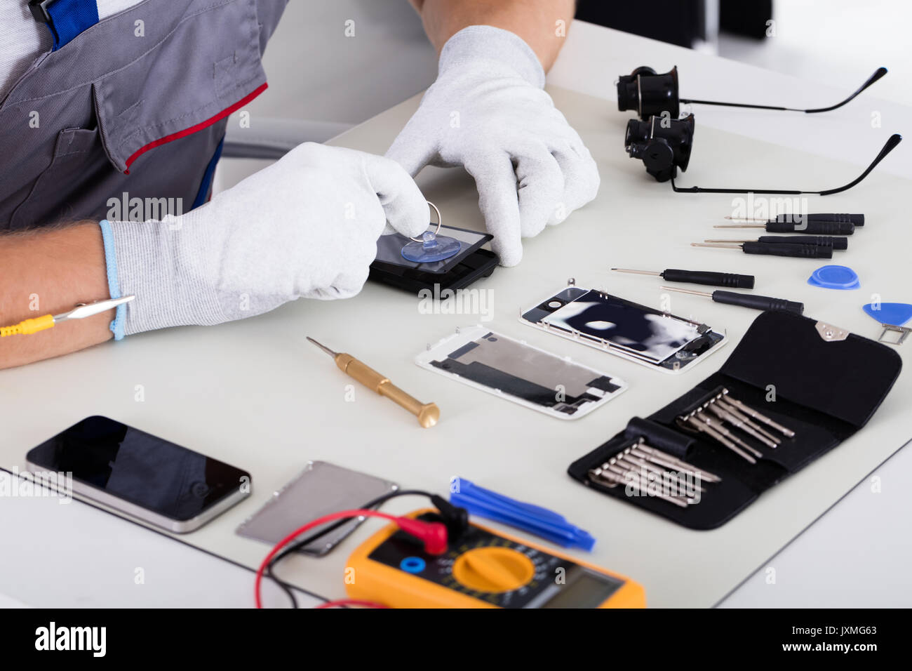Close-up Of Technician Hand Wearing Glove Fixing Smartphone Stock Photo ...