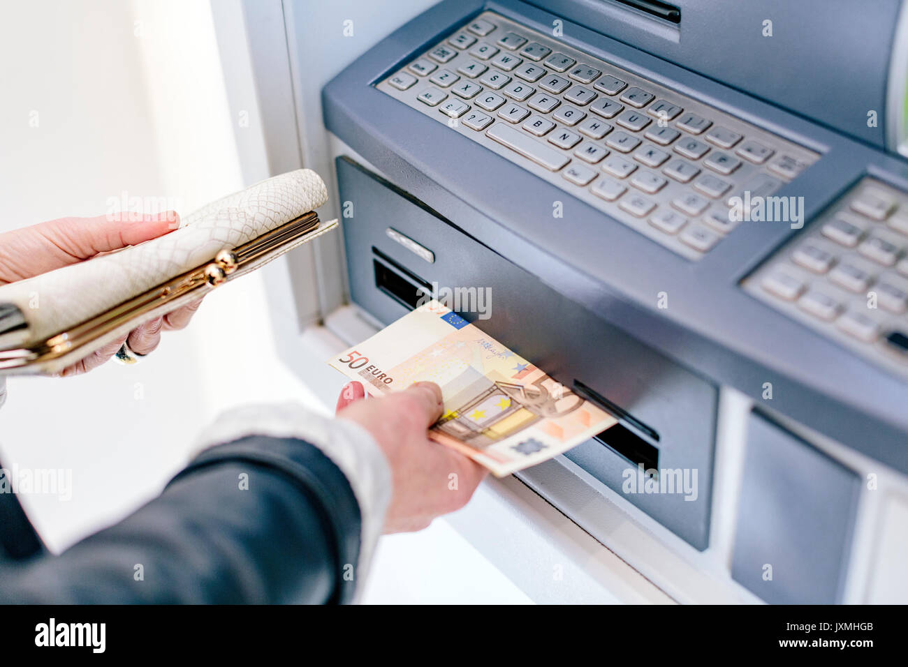 Womans hand withdrawing 50 hi-res stock photography and images - Alamy