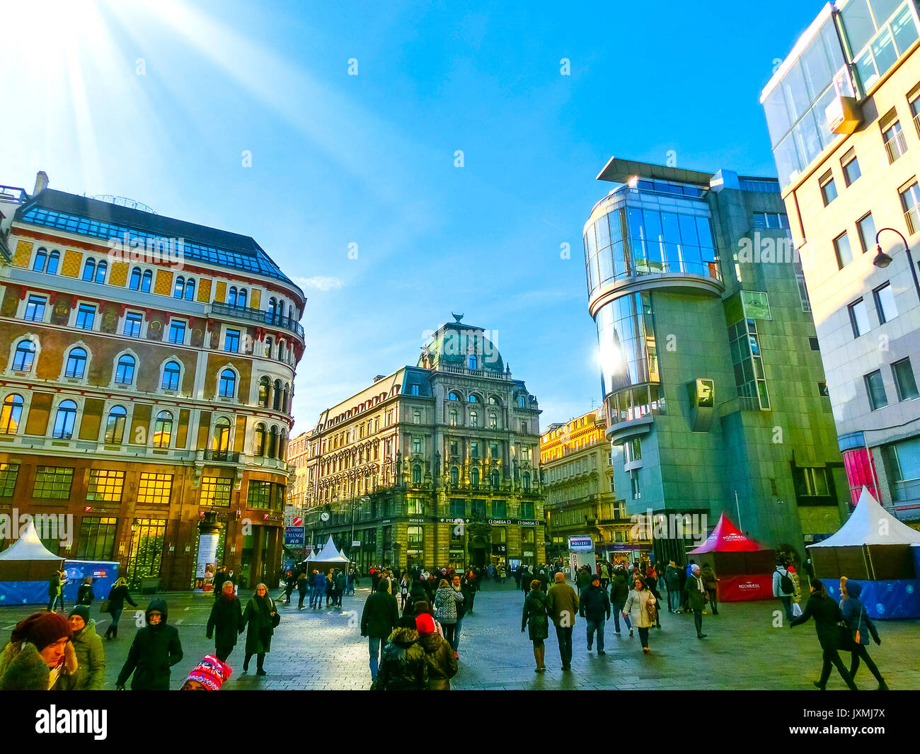 People going on Stock-im-Eisen-Platz near clock in Vienna, Austria ...
