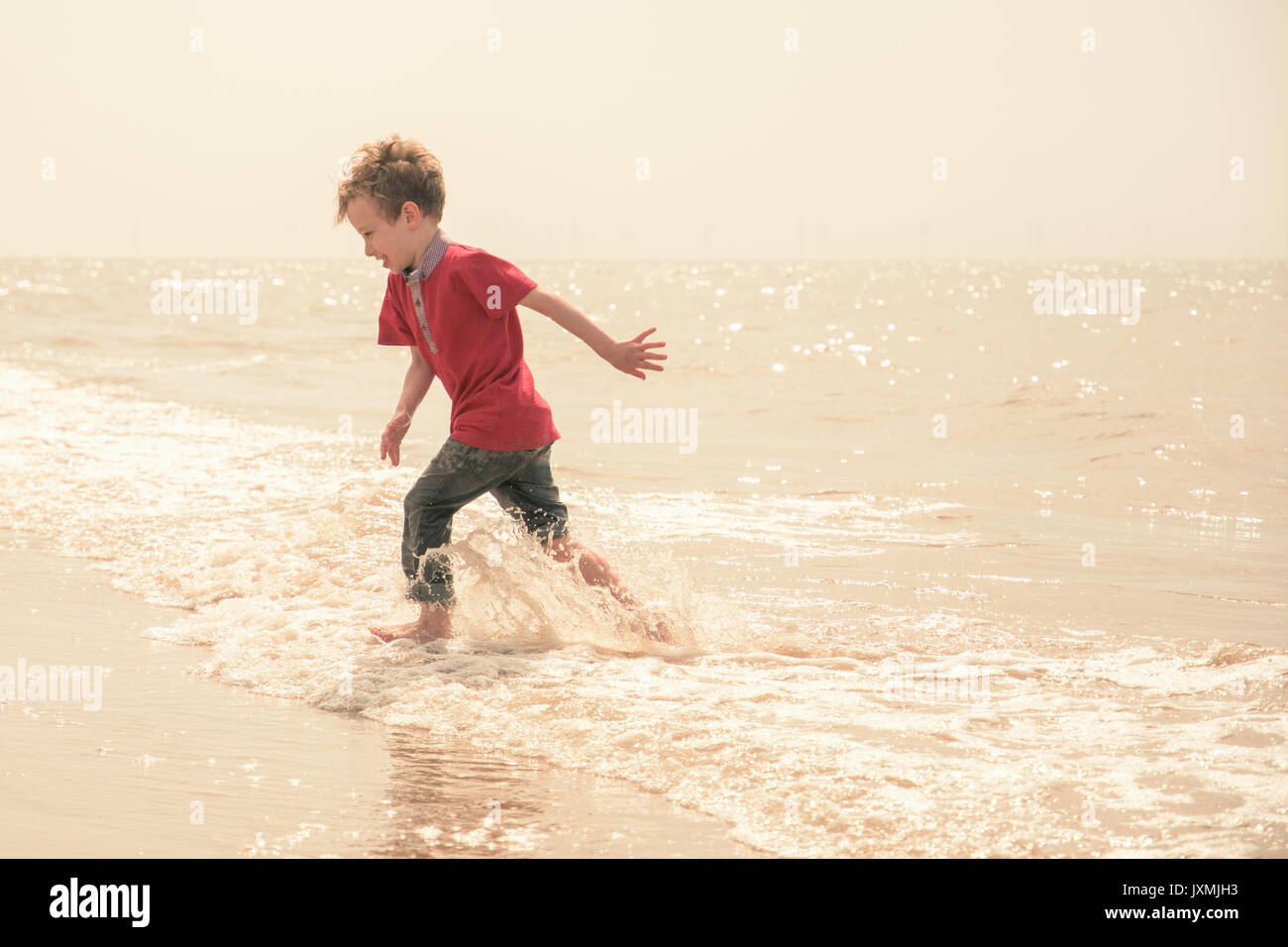 Boy Running Out Of Sea High Resolution Stock Photography and Images - Alamy