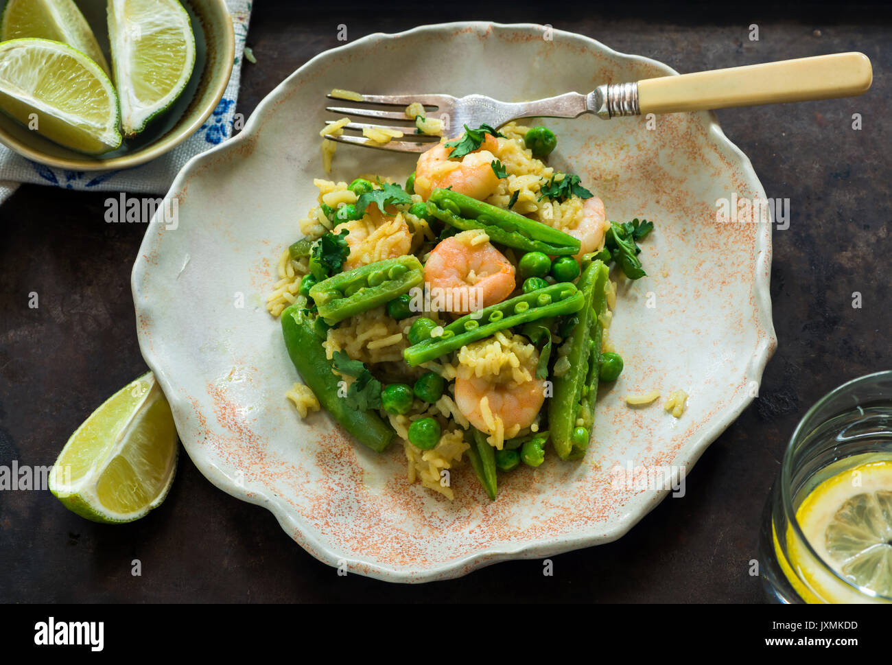 Thai prawn and pea pilaf garnished with a slice of lime - top view ...