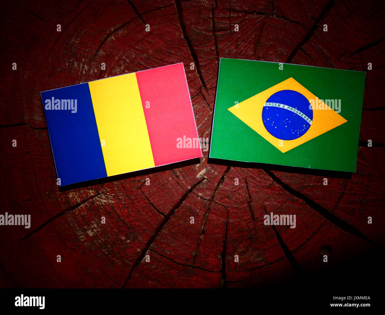 Chad flag with Brazilian flag on a tree stump isolated Stock Photo - Alamy