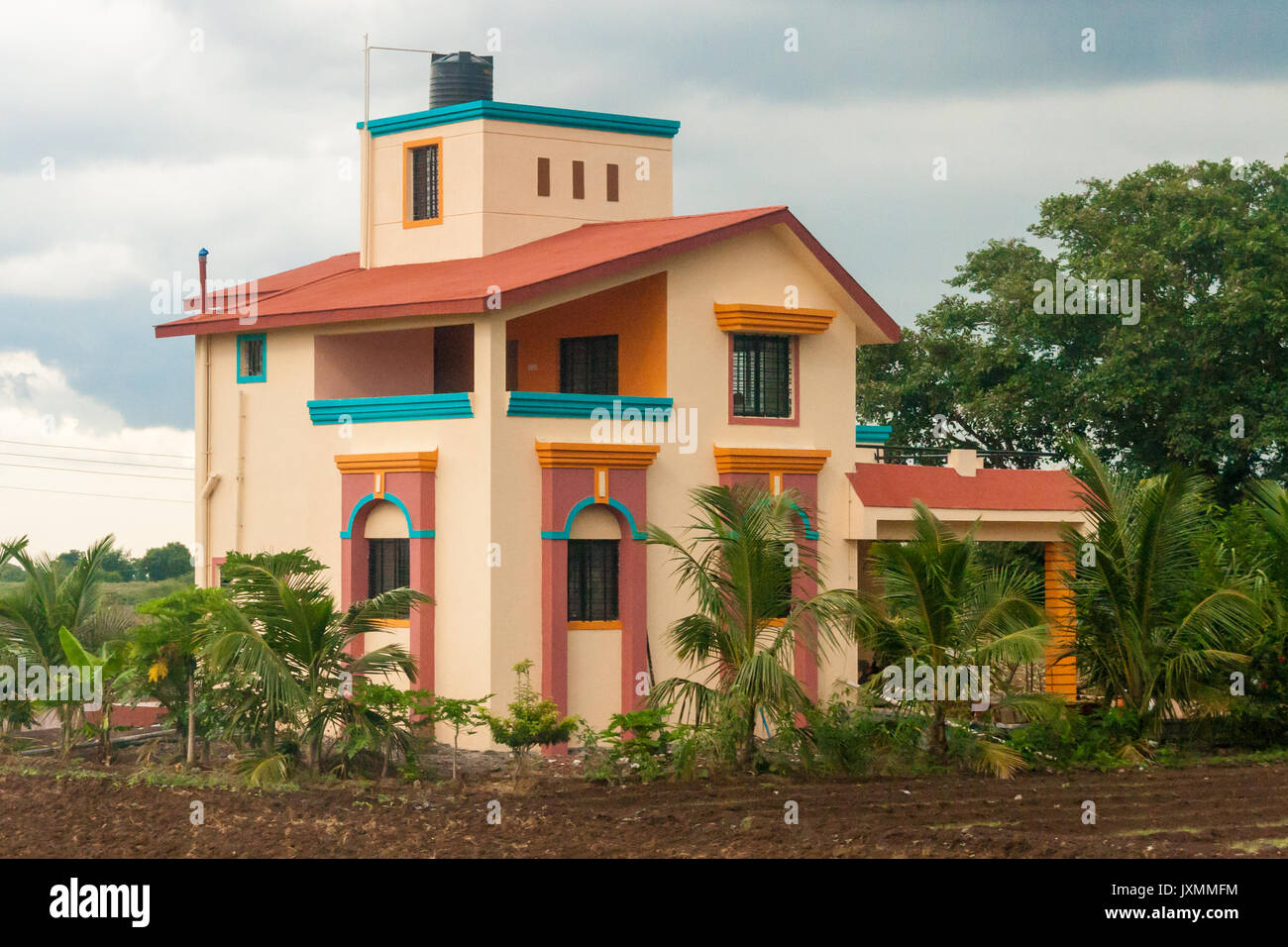 Colorful house in countryside in India Stock Photo - Alamy