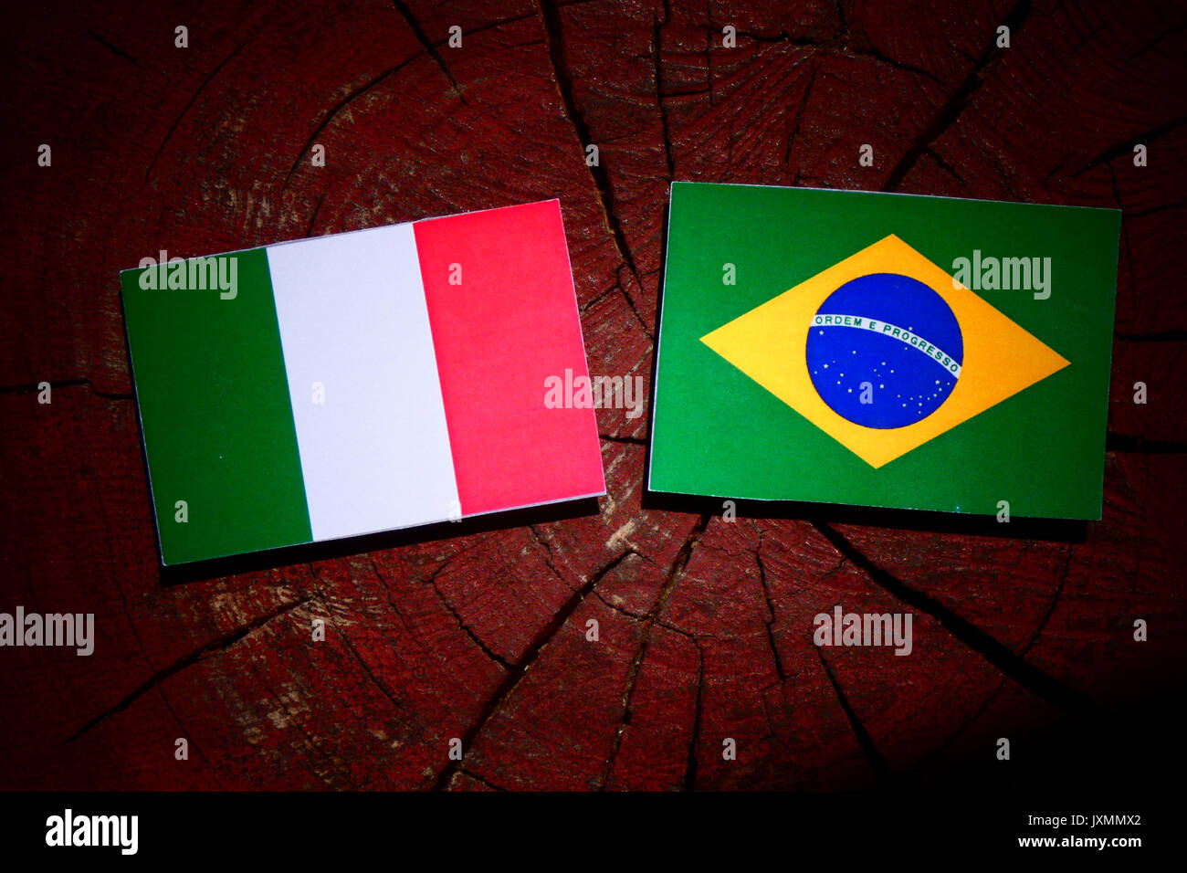 Italian flag with Brazilian flag on a tree stump isolated Stock Photo ...