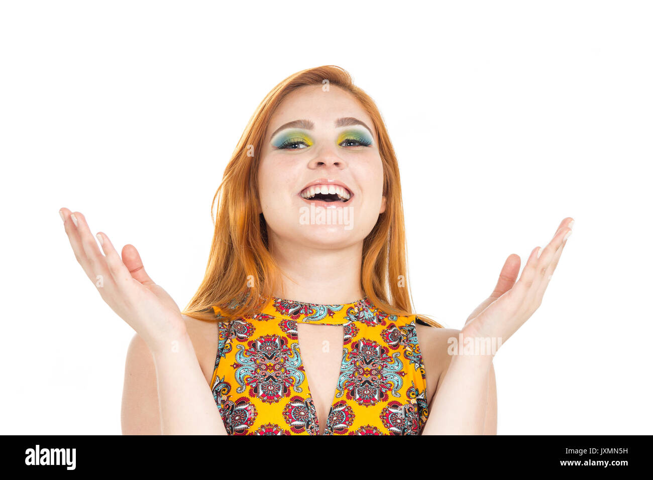 Woman is happy, she is laughing a lot and gesturing with her hands ...