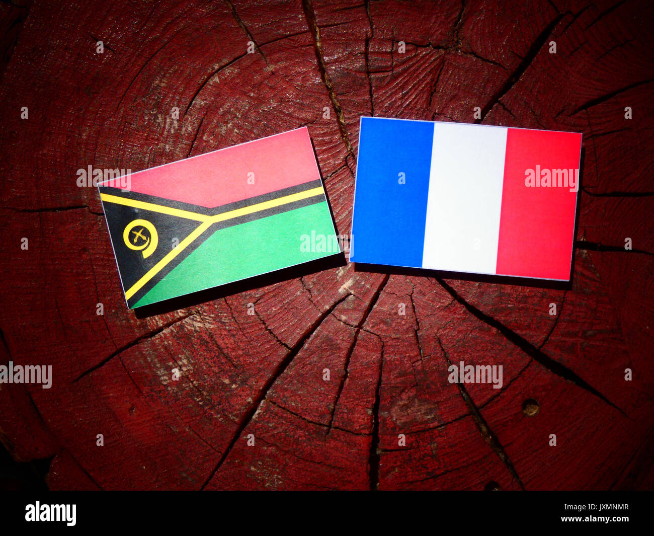 Vanuatu flag with French flag on a tree stump isolated Stock Photo - Alamy