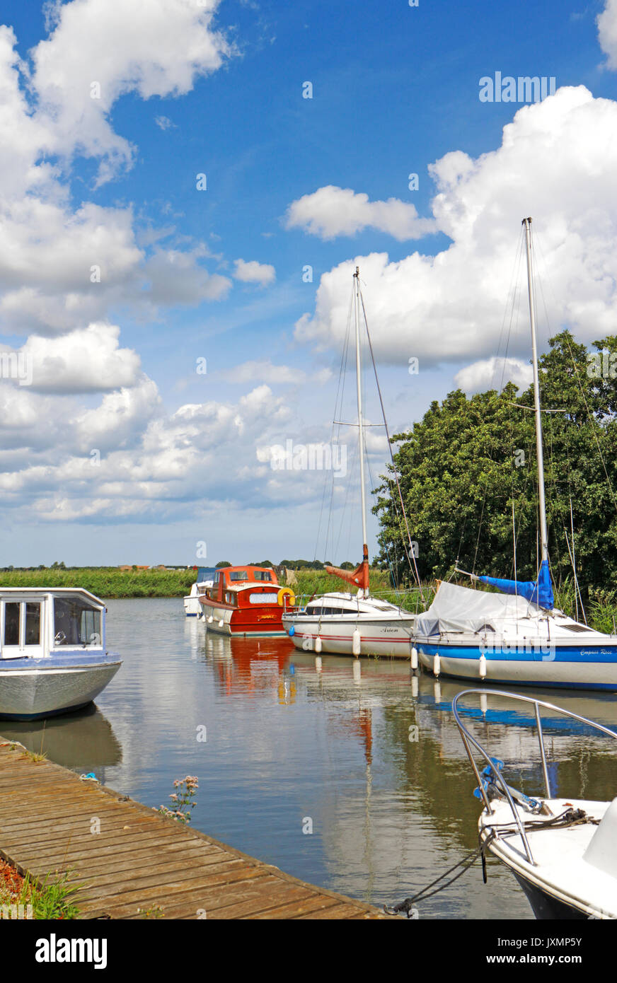 A dyke with moored boats off the River Thurne in the Broads National ...