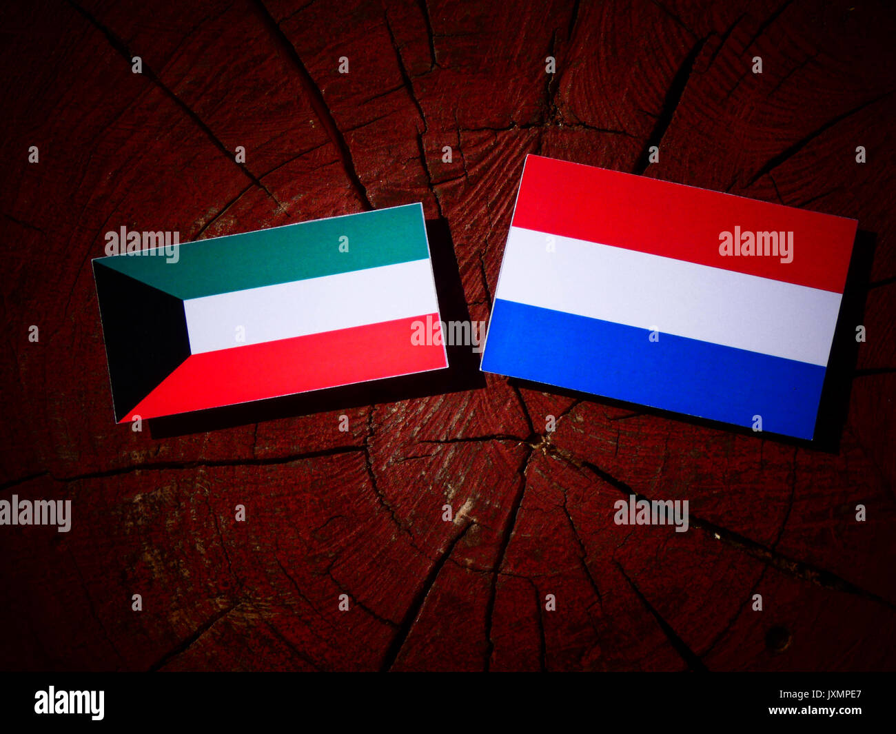 Kuwaiti flag with Dutch flag on a tree stump isolated Stock Photo - Alamy