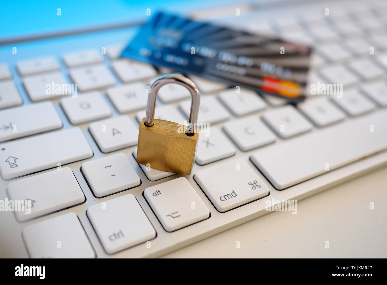 Credit cards on laptop keyboard hi-res stock photography and images - Alamy