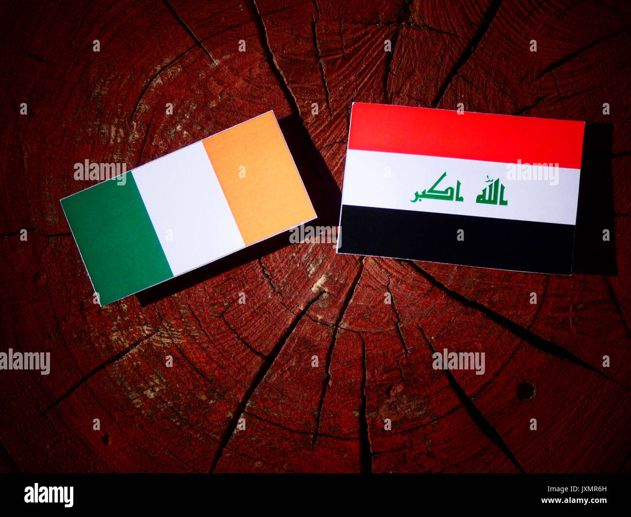 Irish flag with Iraqi flag on a tree stump isolated Stock Photo - Alamy