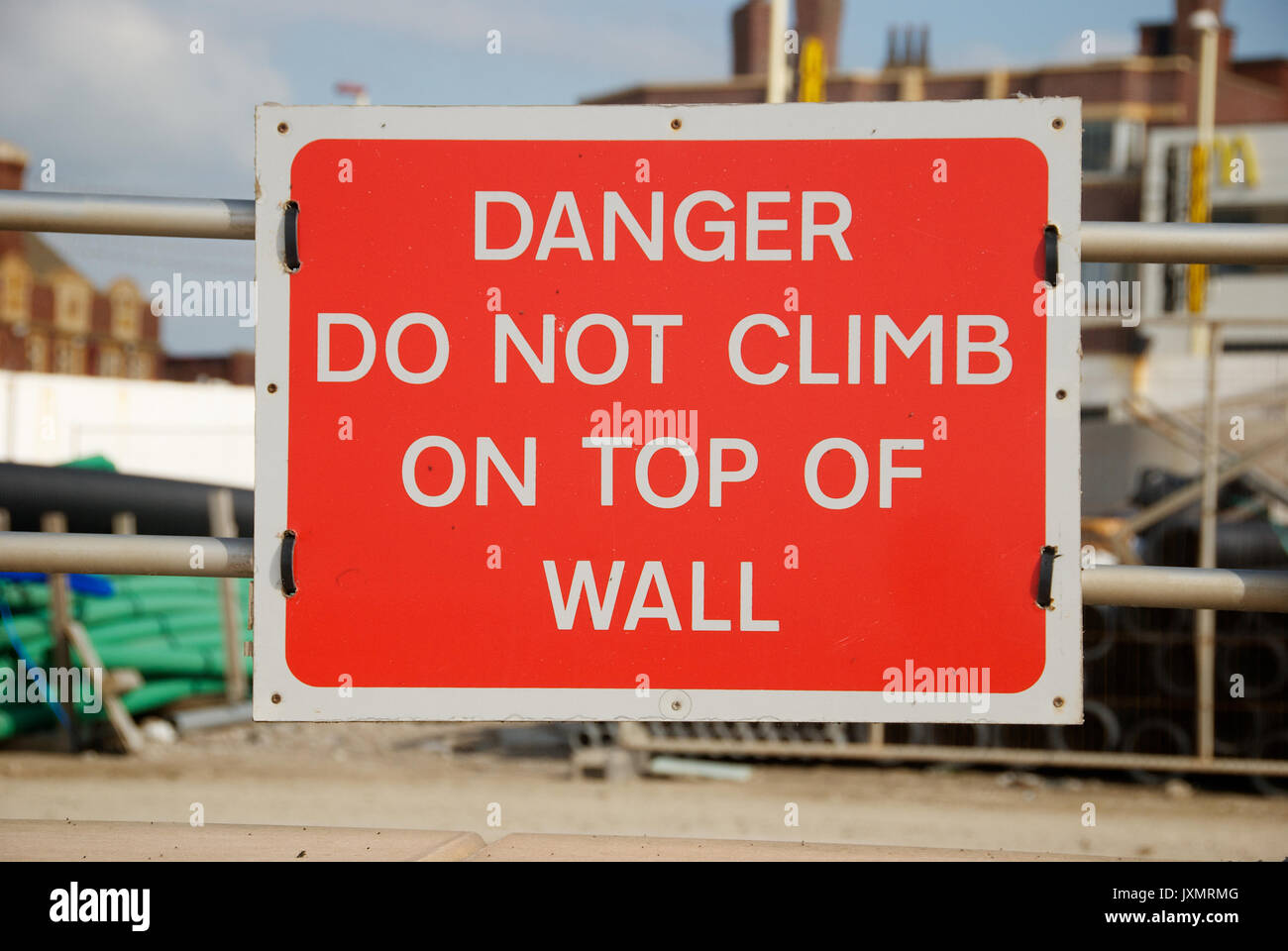 Danger Do Not Climb On Wall sign Stock Photo - Alamy