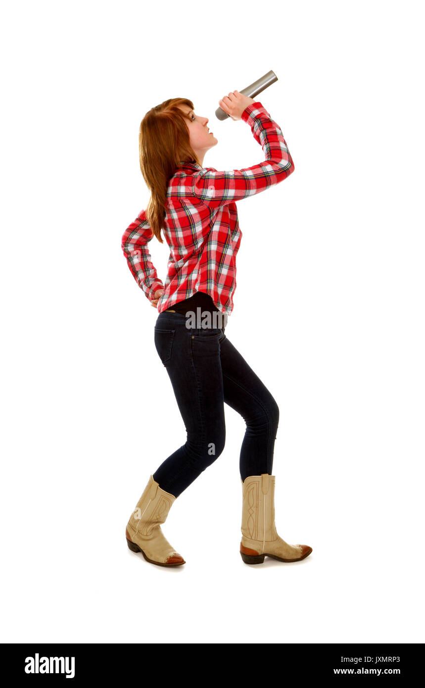 Female Country Western Singer poses with Microphone Stock Photo - Alamy