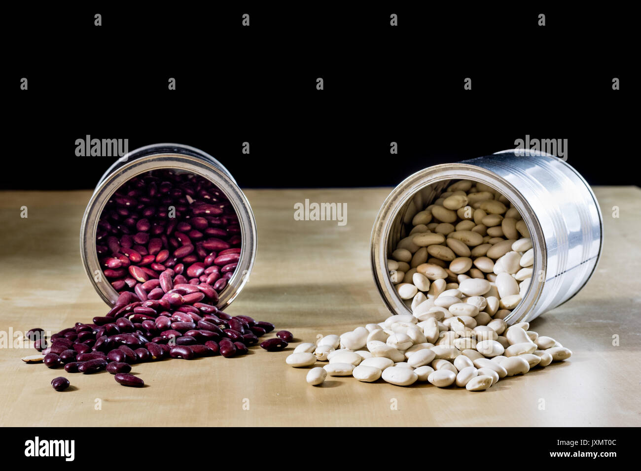 Delicious beans in a metal jar on a wooden kitchen table. Black ...
