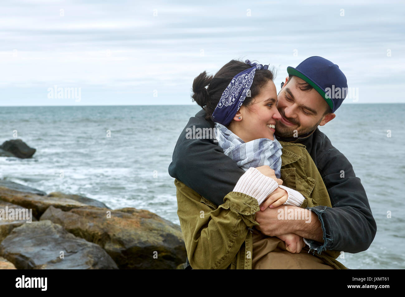 Male female beach hugging hi-res stock photography and images - Alamy