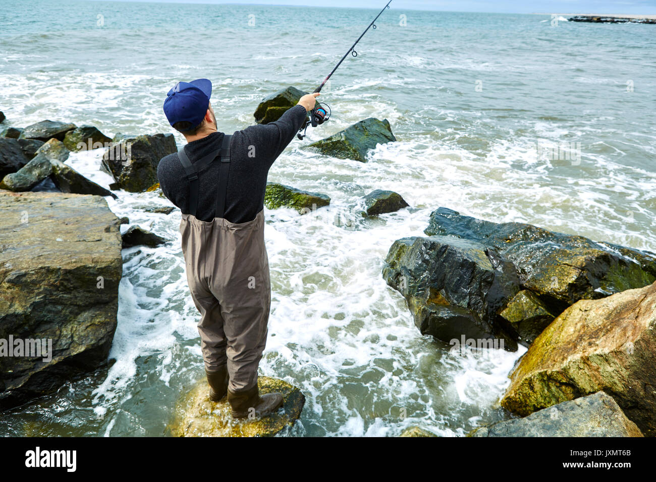Man using fishing rod hi-res stock photography and images - Alamy