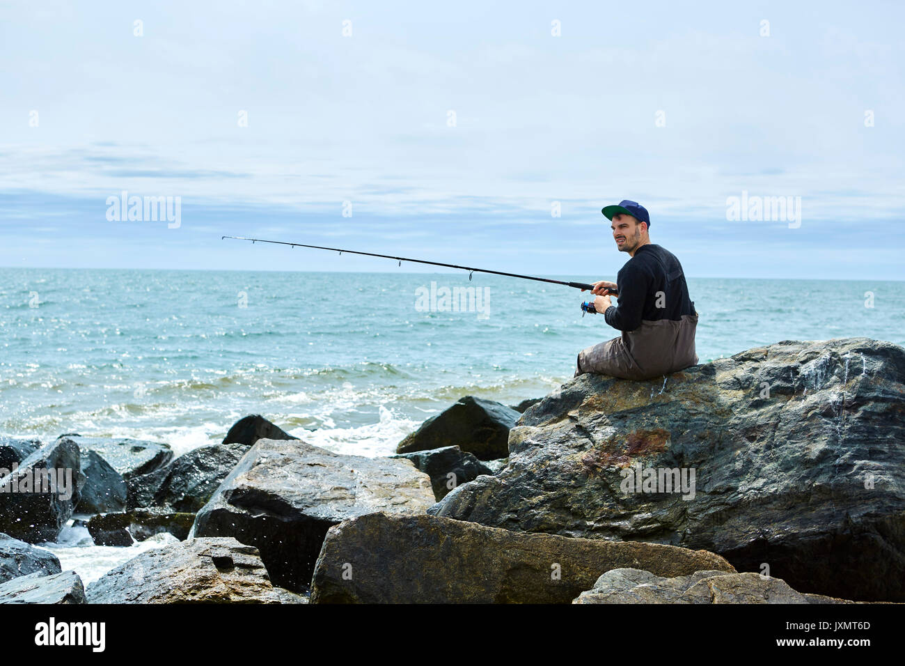 Man using fishing rod hi-res stock photography and images - Alamy