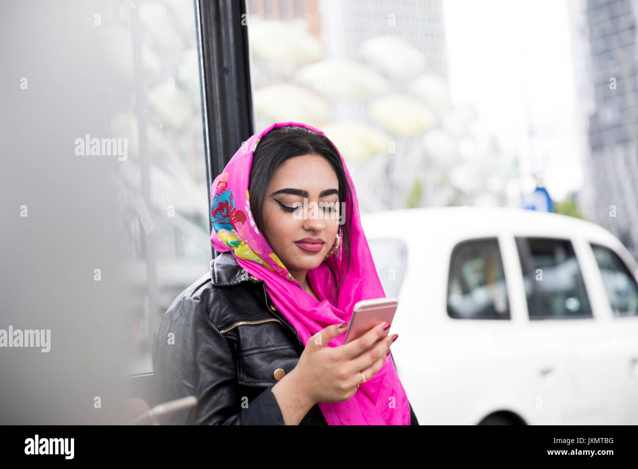 Young woman bus stop hi-res stock photography and images - Alamy