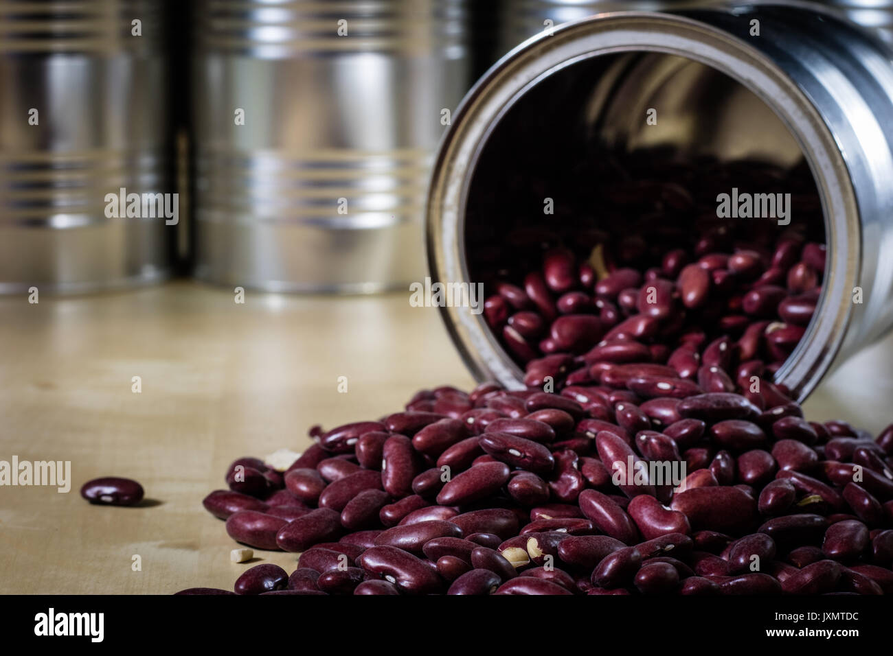 Delicious beans in a metal jar on a wooden kitchen table. Black ...