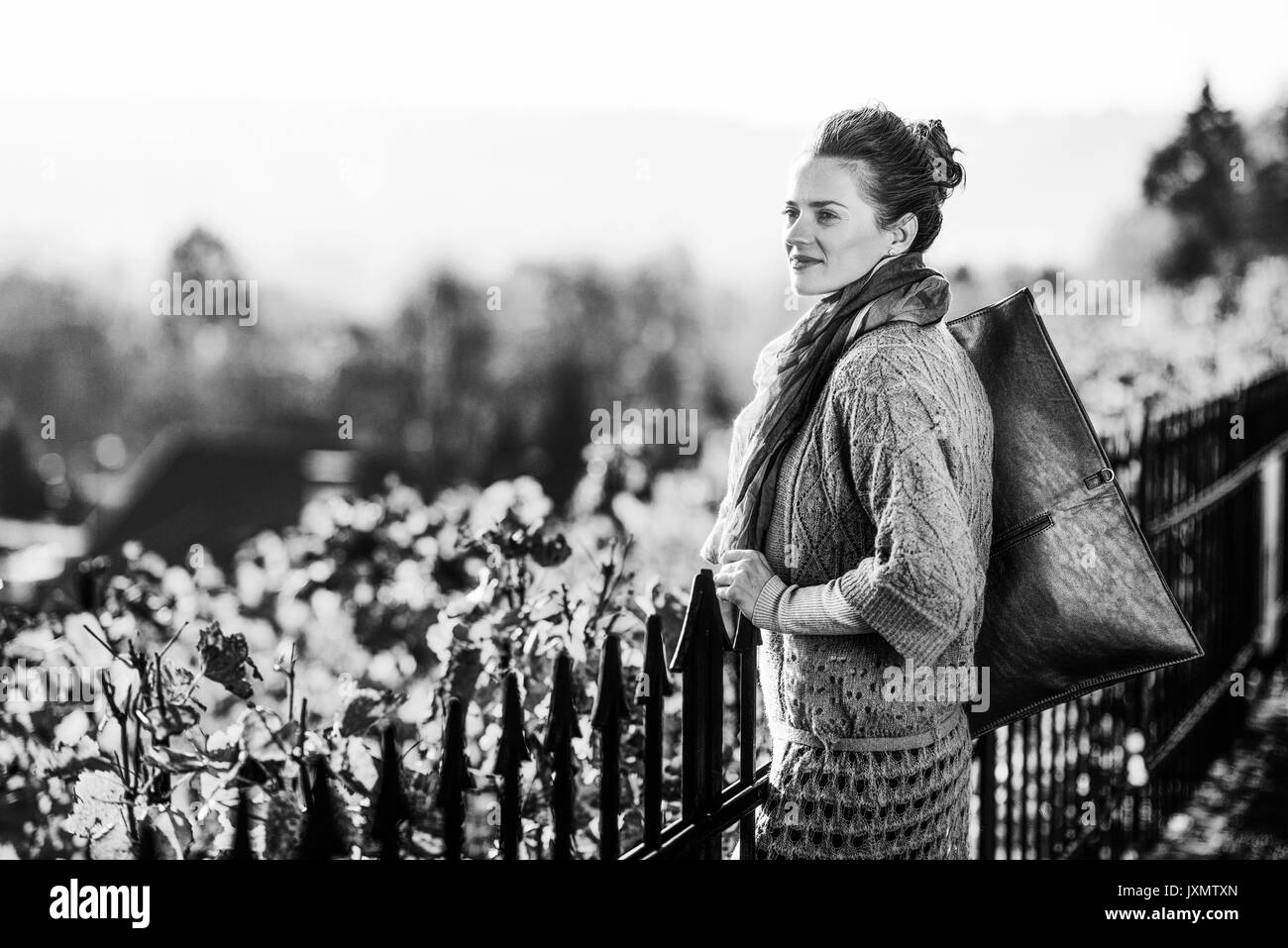 Young woman in autumn outdoors looking into distance Stock Photo - Alamy