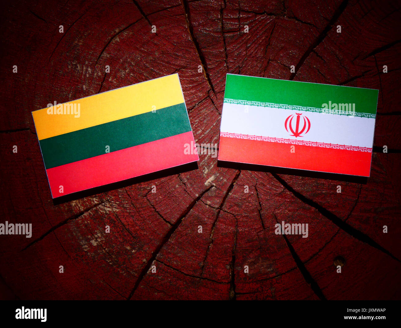 Lithuanian flag with Iranian flag on a tree stump isolated Stock Photo ...