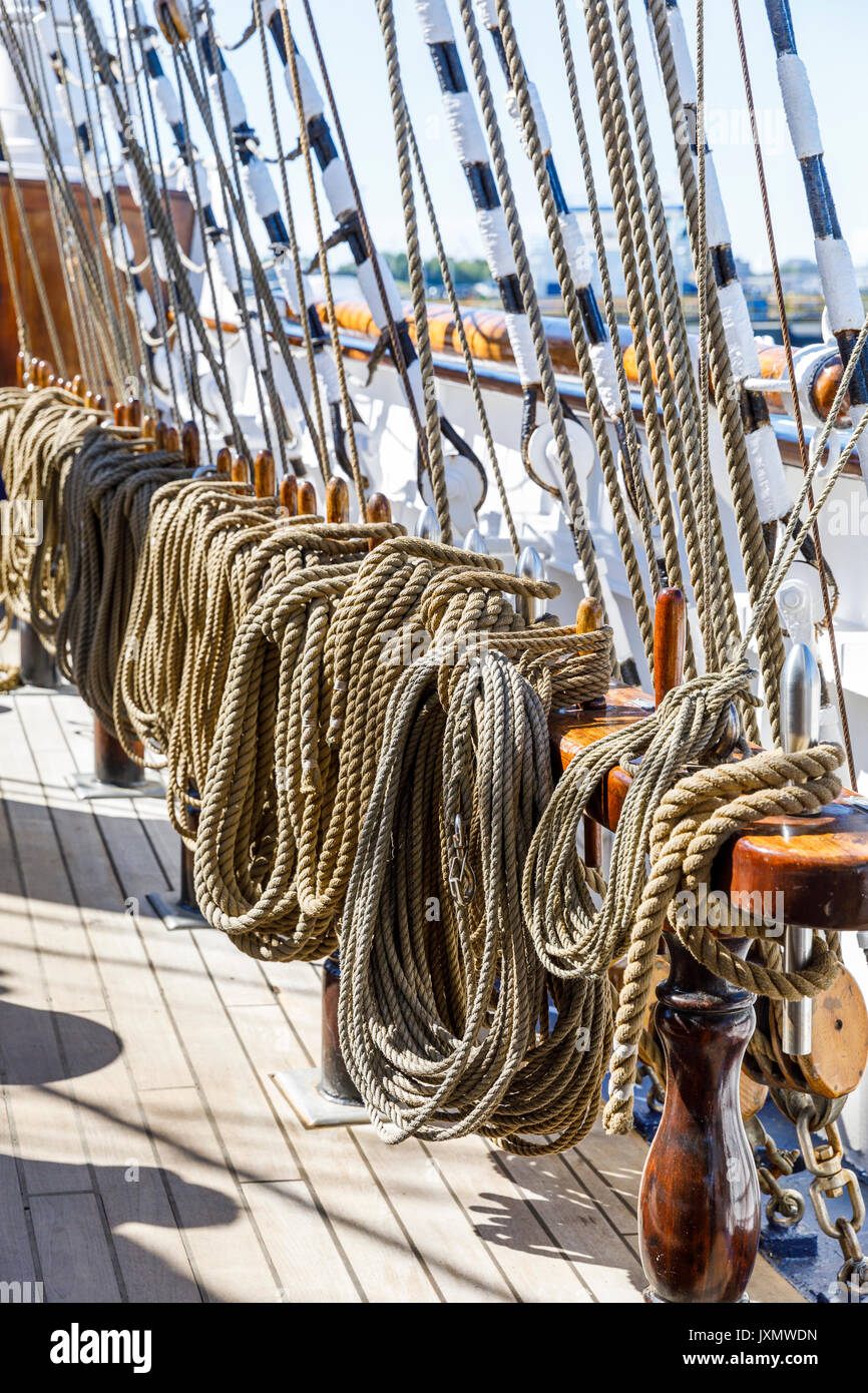 Many brownish thick ropes bend together in a sailing ship Stock Photo ...