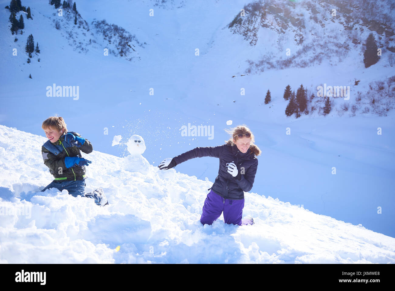 Siblings having snow ball fight, Hintertux, Tirol, Austria Stock Photo ...