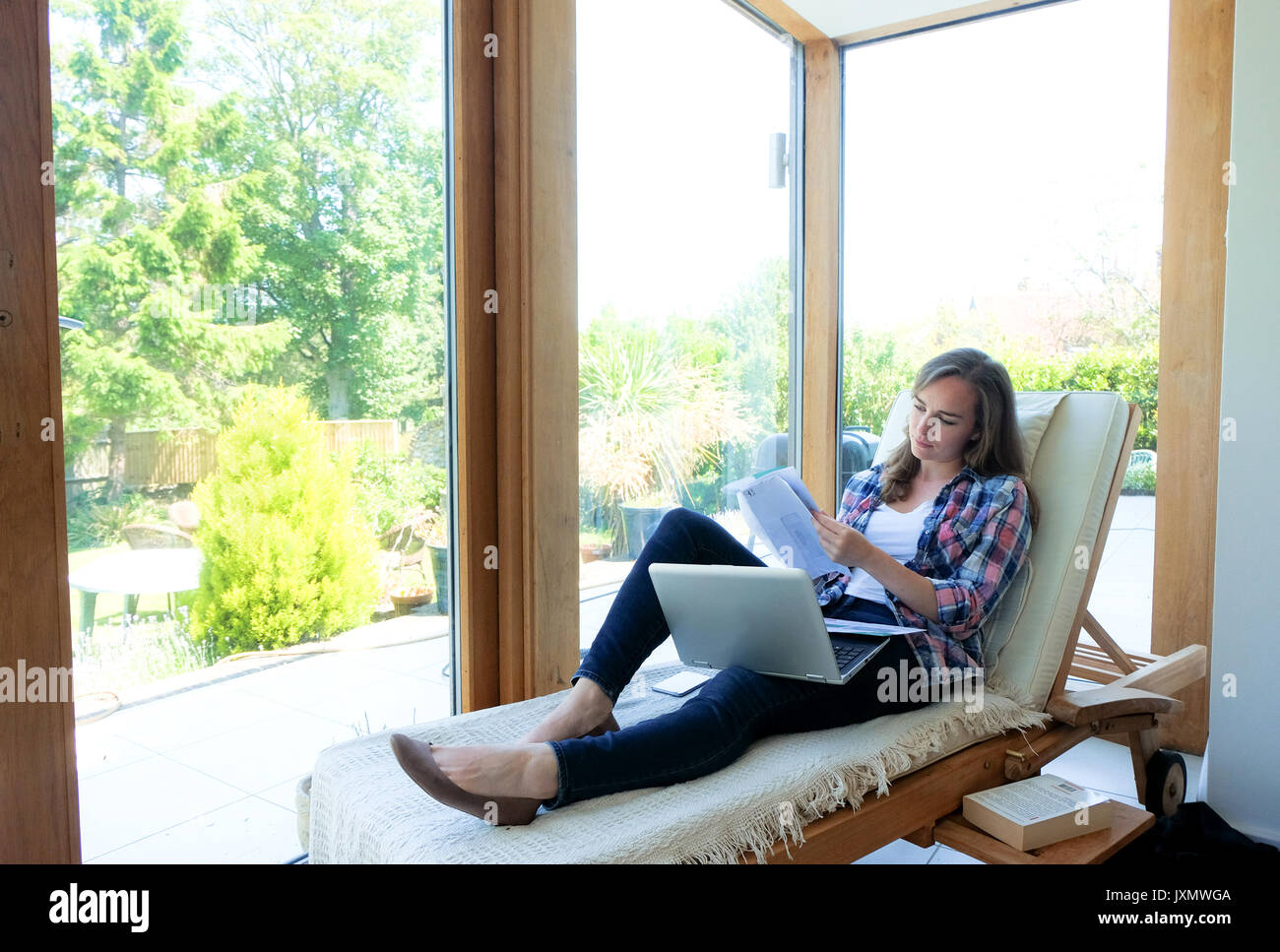 Reclining chair woman hi-res stock photography and images - Alamy