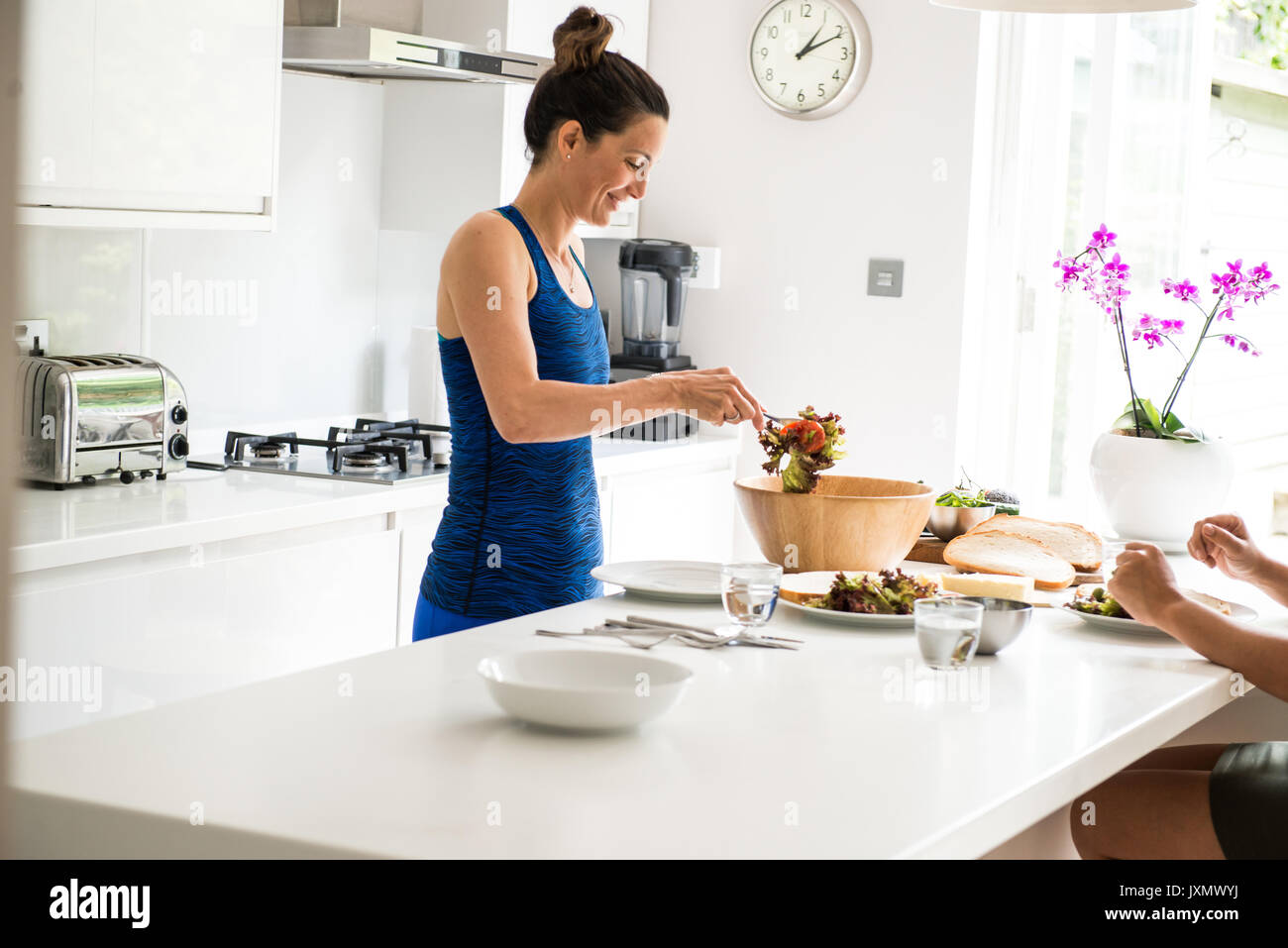 Woman preparing salad lunch Stock Photo - Alamy