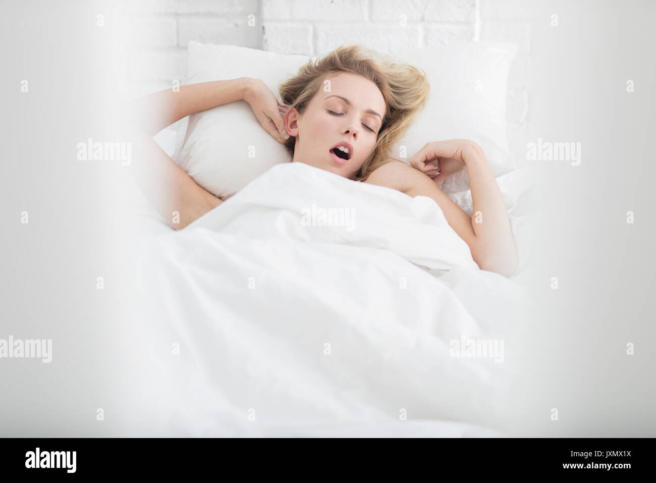 Yawning woman bed hi-res stock photography and images - Alamy