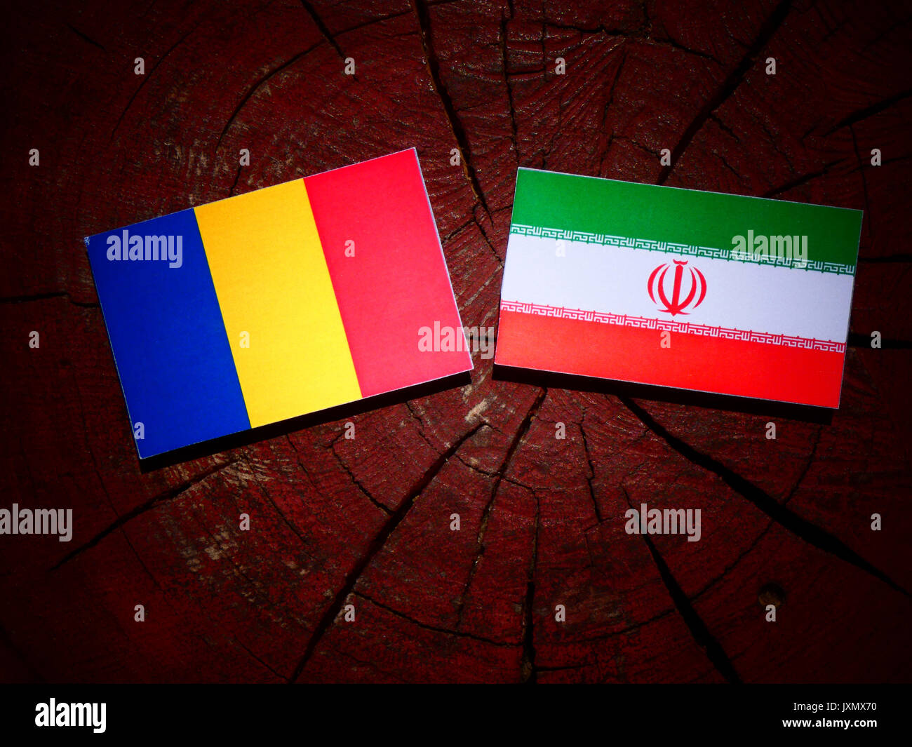 Chad flag with Iranian flag on a tree stump isolated Stock Photo - Alamy