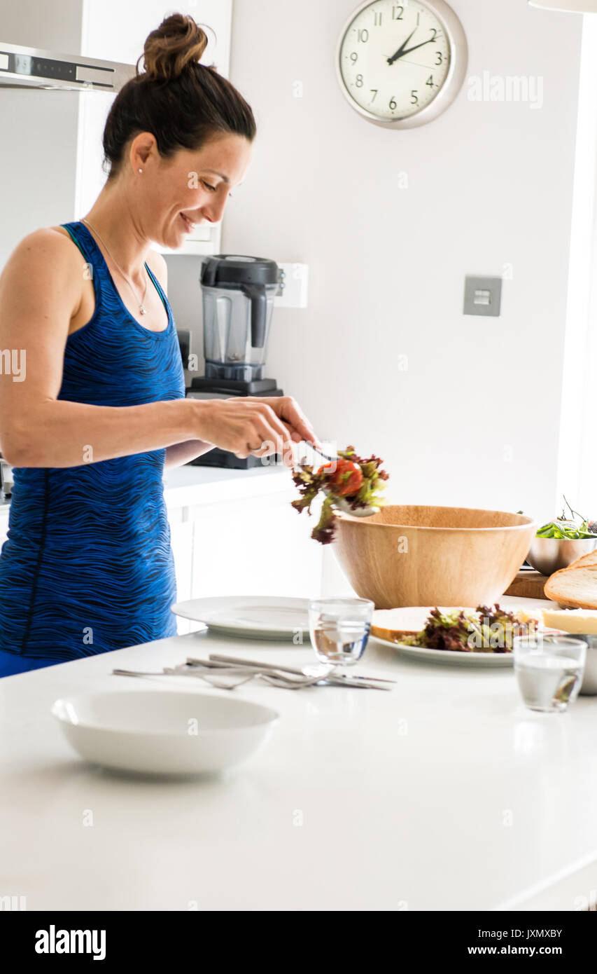 Woman preparing salad lunch Stock Photo - Alamy