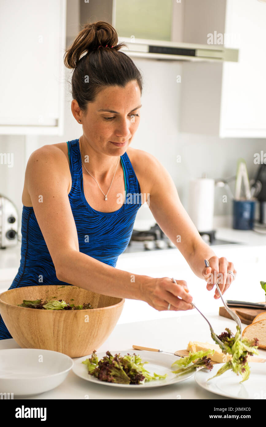 Woman serving lunch hi-res stock photography and images - Alamy
