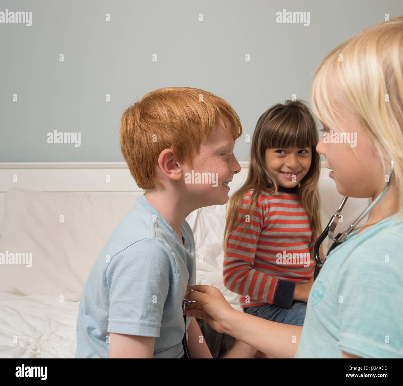 Brother sister playing doctor stethoscope hi-res stock photography and ...