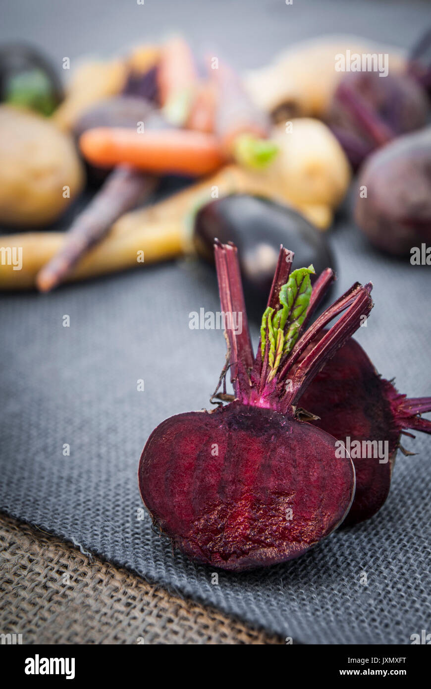 Selection of vegetables, beetroot cut in half in foreground, close-up ...
