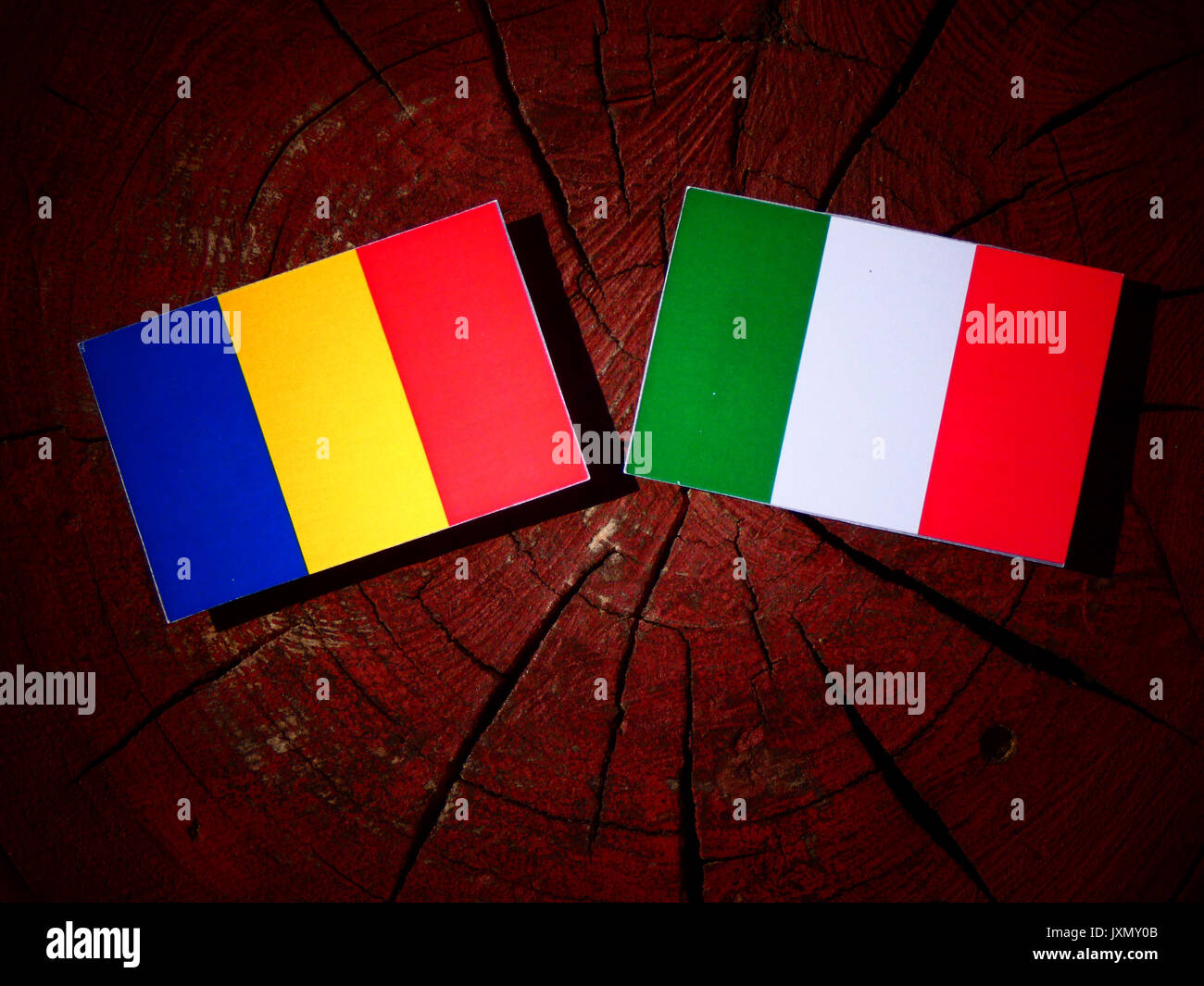 Chad flag with Italian flag on a tree stump isolated Stock Photo - Alamy
