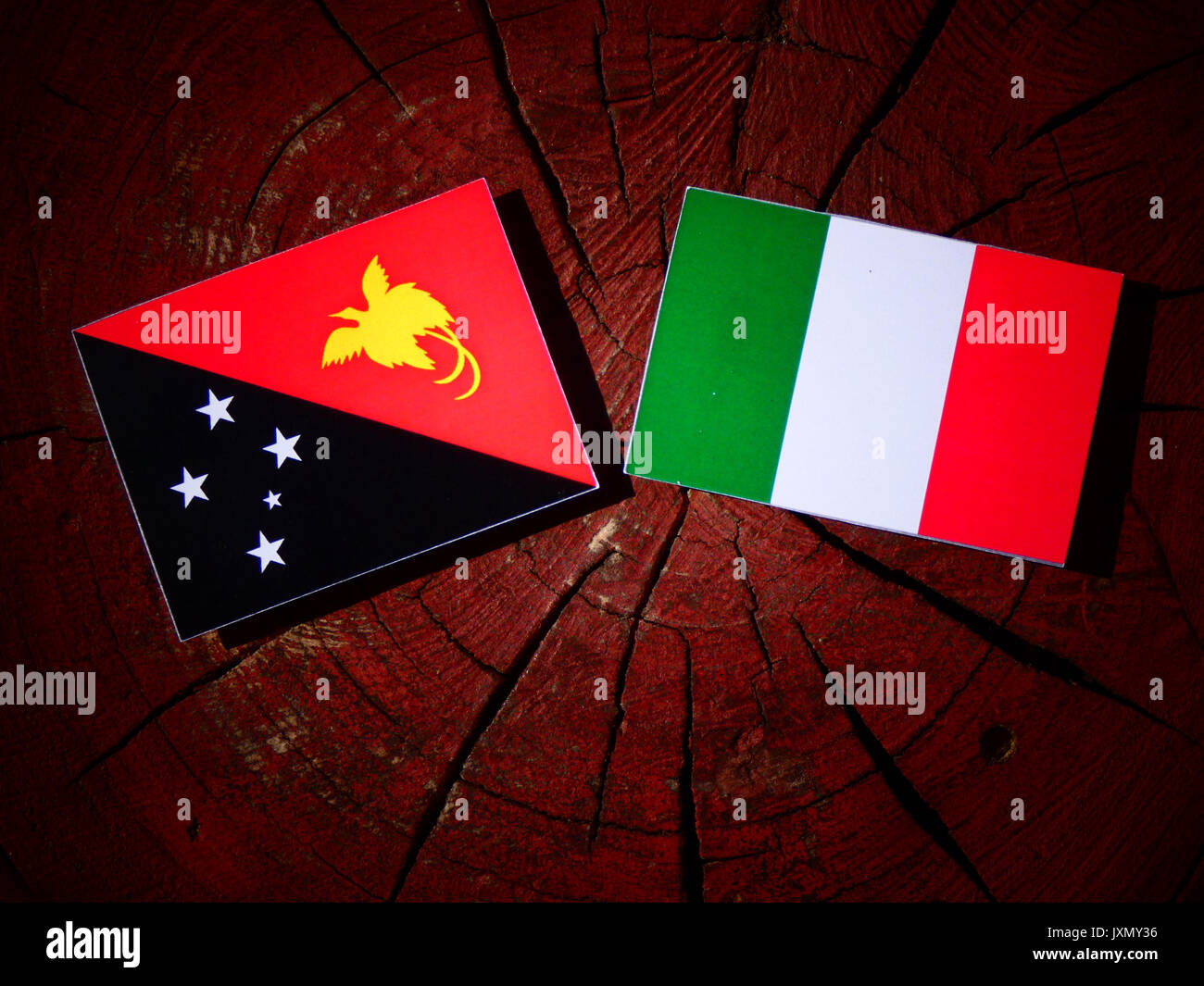 Papua New Guinea flag with Italian flag on a tree stump isolated Stock ...