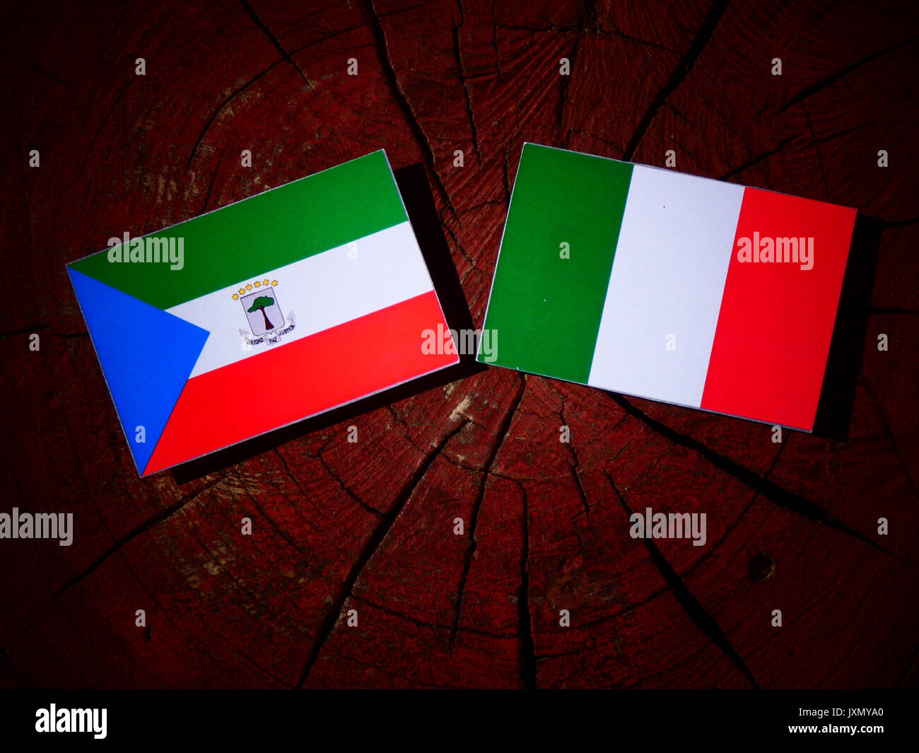 Equatorial Guinea flag with Italian flag on a tree stump isolated Stock ...