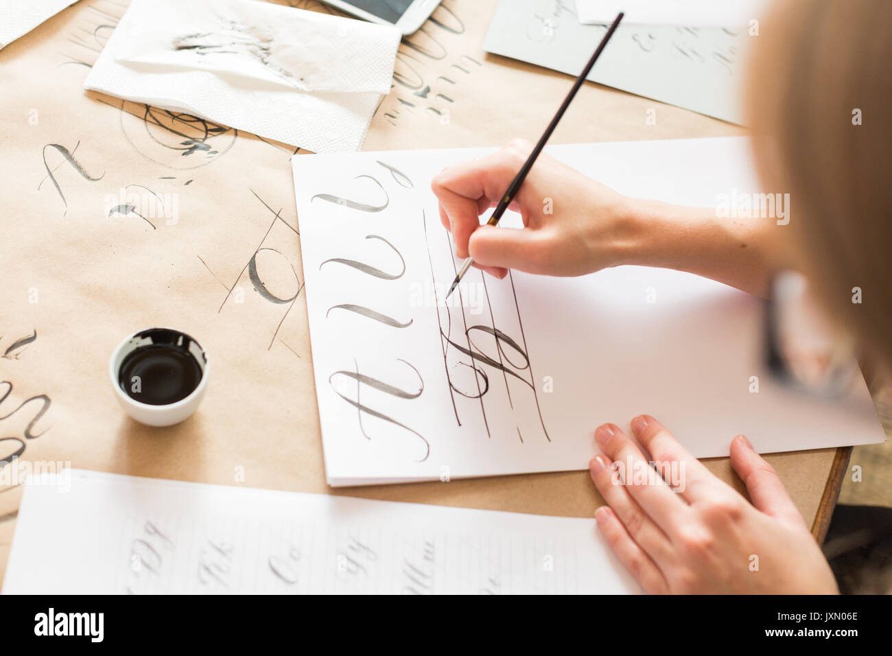 calligraphy, handwriting, technique concept. woman with beautiful ...