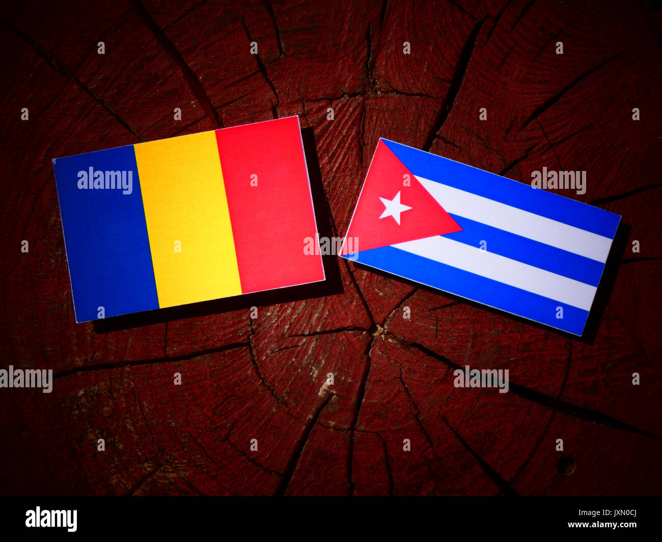 Chad flag with Cuban flag on a tree stump isolated Stock Photo - Alamy