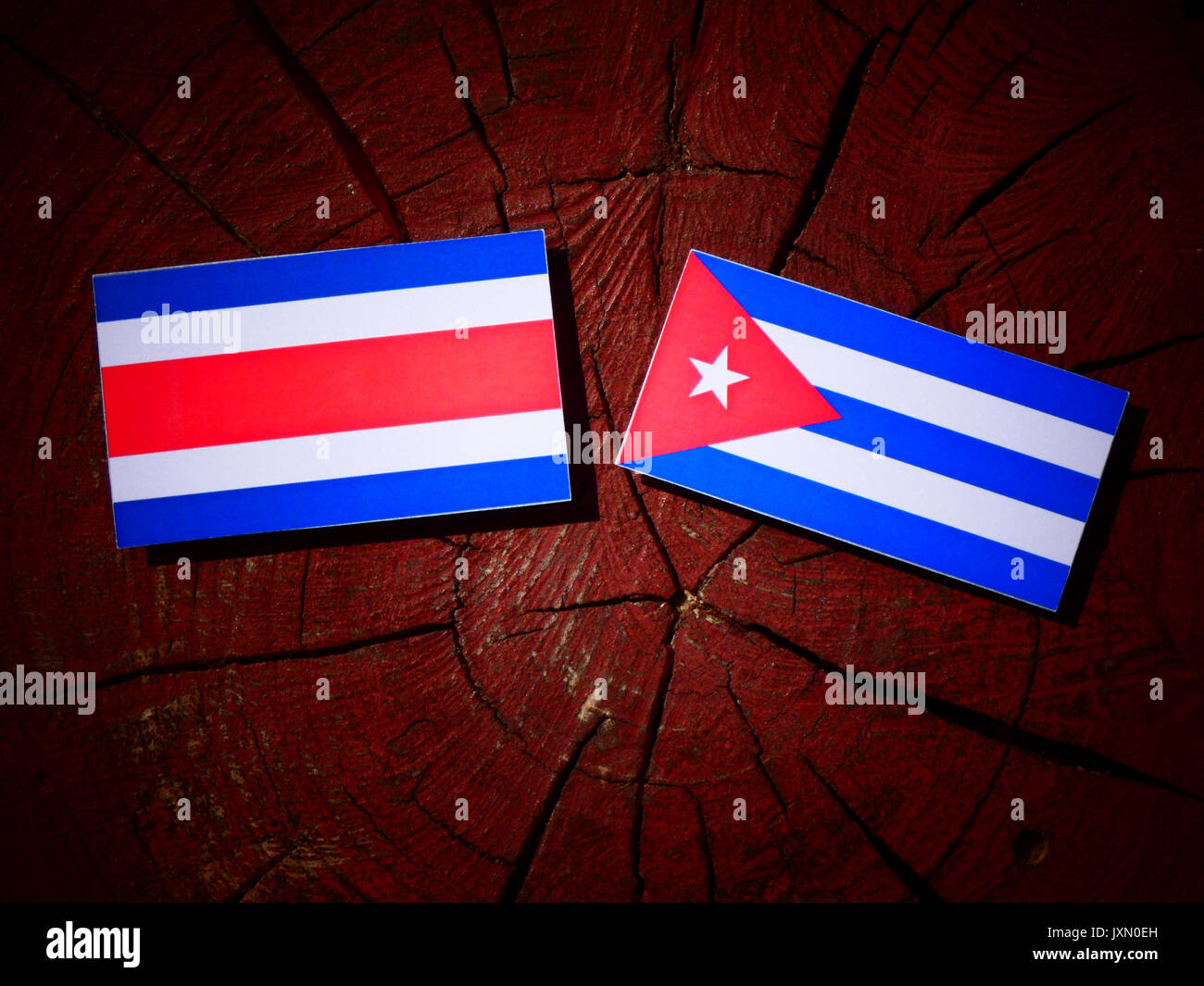 Costa Rican flag with Cuban flag on a tree stump isolated Stock Photo ...