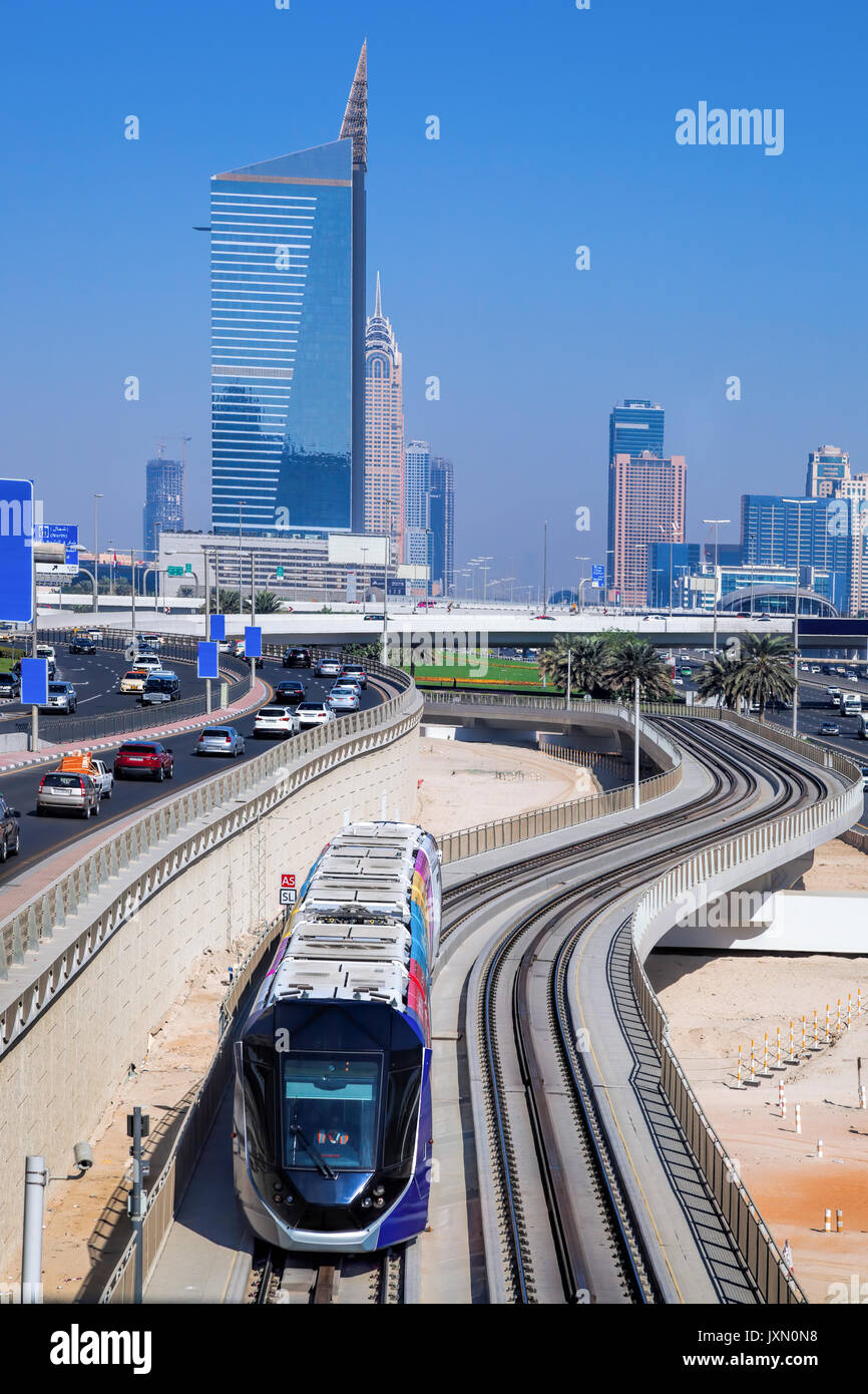 Dubai city with tramway against skyscrapers in United Arab Emirates ...