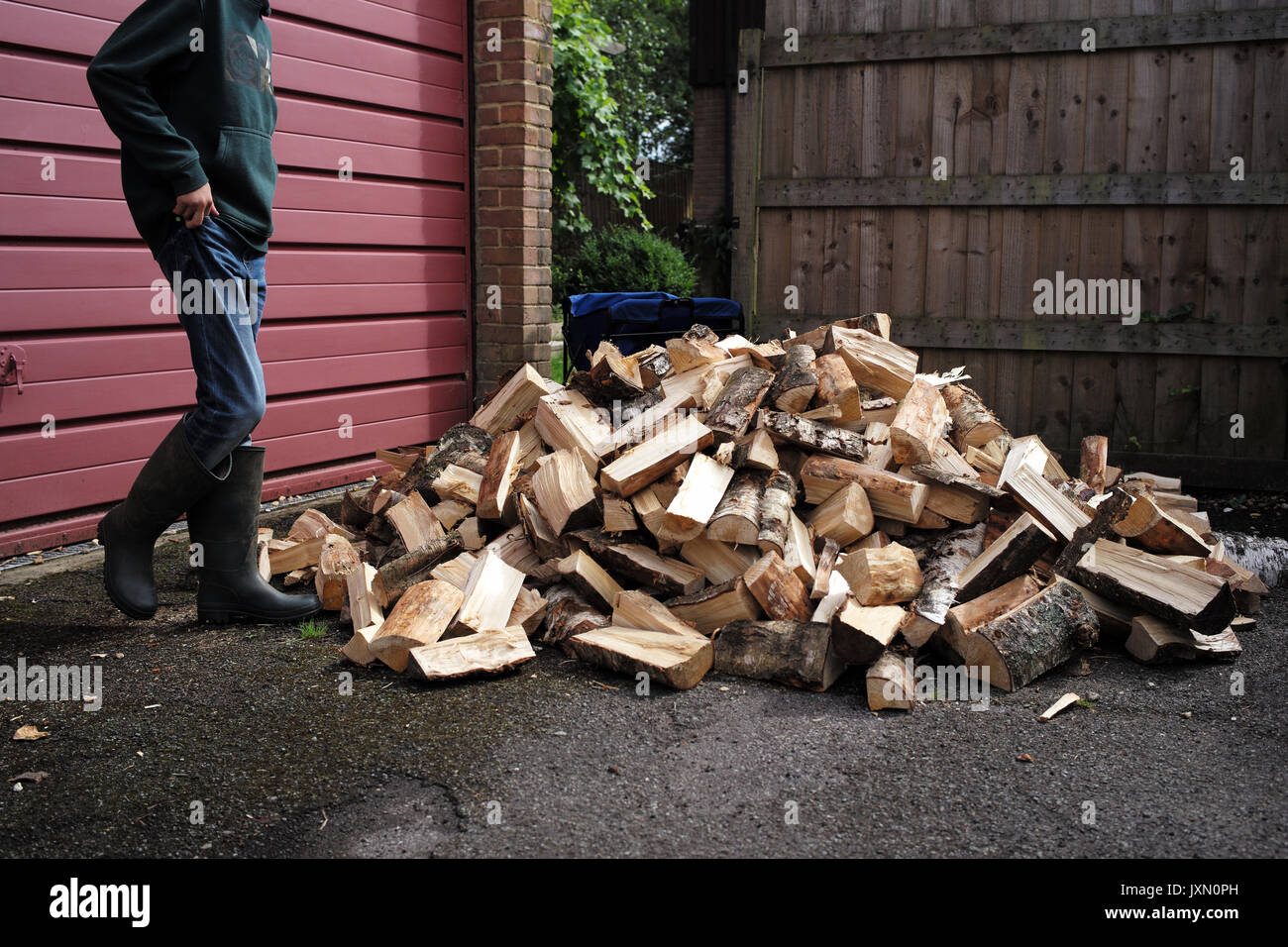 A pile of chopped fire wood logs ready for the cooler months and winter ...