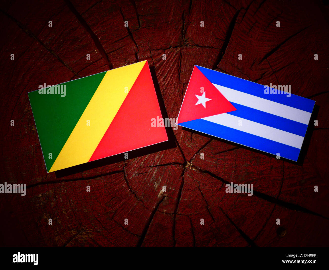 Republic of the Congo flag with Cuban flag on a tree stump isolated ...