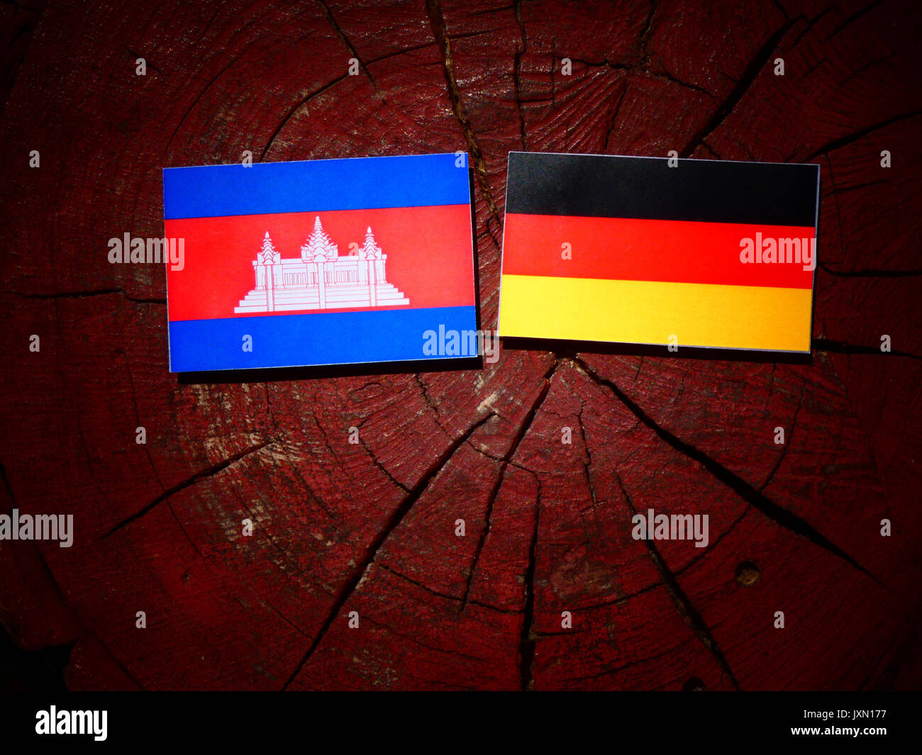 Cambodian flag with German flag on a tree stump isolated Stock Photo ...