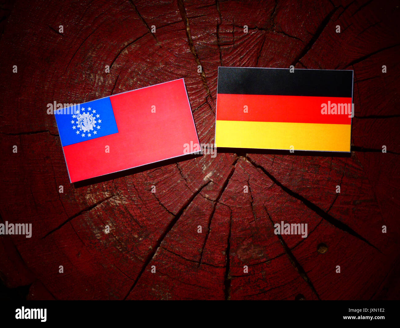 Myanmar flag with German flag on a tree stump isolated Stock Photo - Alamy