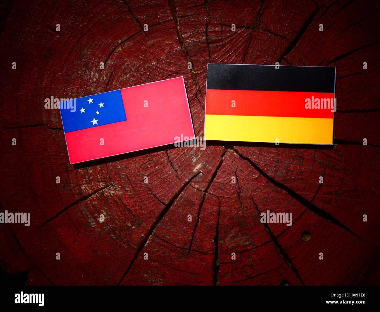 Samoa flag with German flag on a tree stump isolated Stock Photo - Alamy