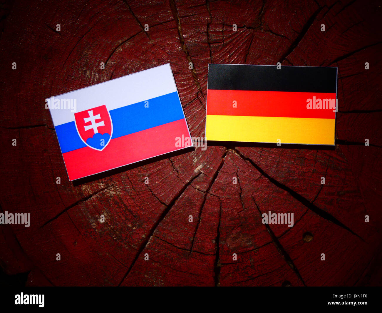 Slovakian flag with German flag on a tree stump isolated Stock Photo ...